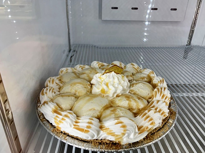 This caramel apple pie creation isn't just dessert, it's architecture—with whipped cream buttresses supporting a golden caramel dome.