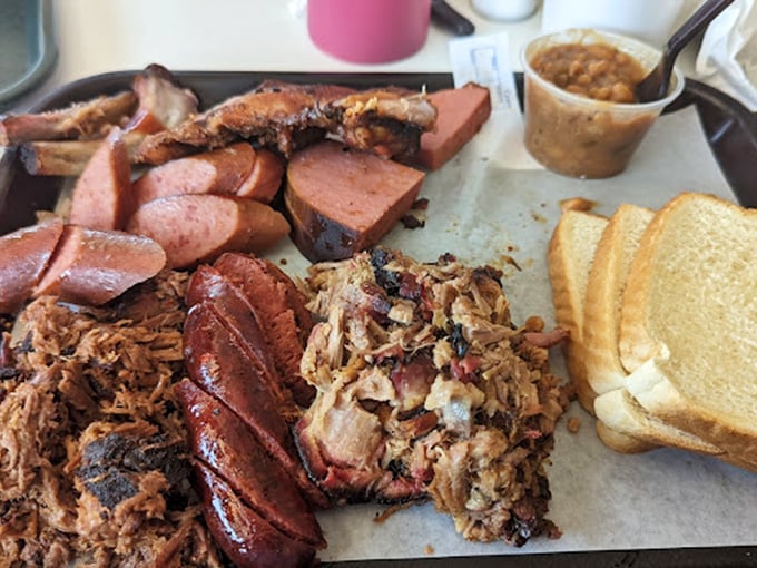 A tray where pulled pork, hot links, and white bread coexist in perfect harmony. If only world leaders could learn from barbecue.