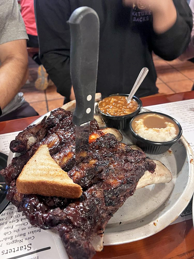 A meat lover's dream plate where multiple species have been smoked to perfection, proving that peaceful coexistence is possible&mdash;at least until dinner's over.