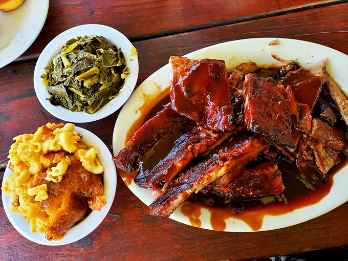 The barbecue equivalent of "why choose?" &ndash; brisket and ribs sharing a plate like old friends, with collard greens and potato salad as wingmen.