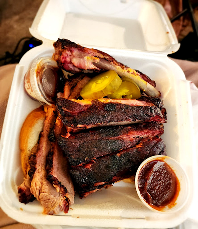 7.aThe barbecue trifecta &ndash; ribs, sausage, and sides that make you wonder why you ever bothered with fancy restaurants and their tiny portions.ribs and brisket