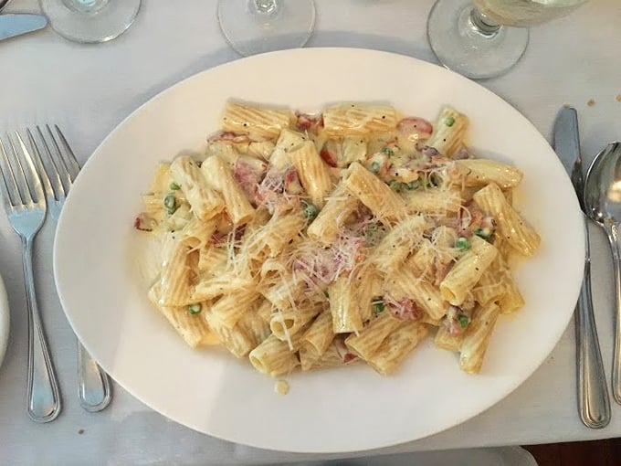 Rigatoni carbonara that's worth breaking any diet for. Each tube of pasta cradles the creamy sauce like it was born for this purpose.