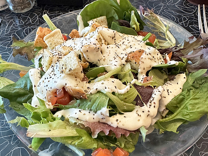 When your salad arrives looking this fresh and abundant, you can almost convince yourself you're making healthy choices. Almost.