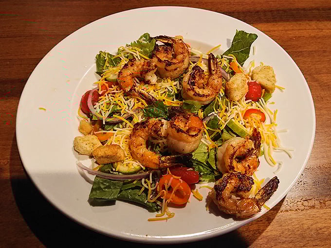 Who said healthy can't be exciting? These blackened shrimp stand at attention atop a colorful salad like tiny flavor sentinels guarding your taste buds.