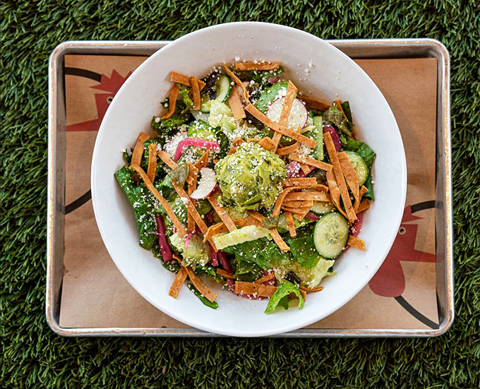 A salad so vibrant it practically photosynthesizes on your plate. Proof that green things can coexist beautifully with fried chicken indulgence.