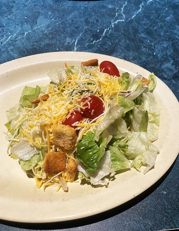 Even the salad gets the royal treatment here. A refreshing palate cleanser or, as regulars call it, "the thing you eat to justify dessert."