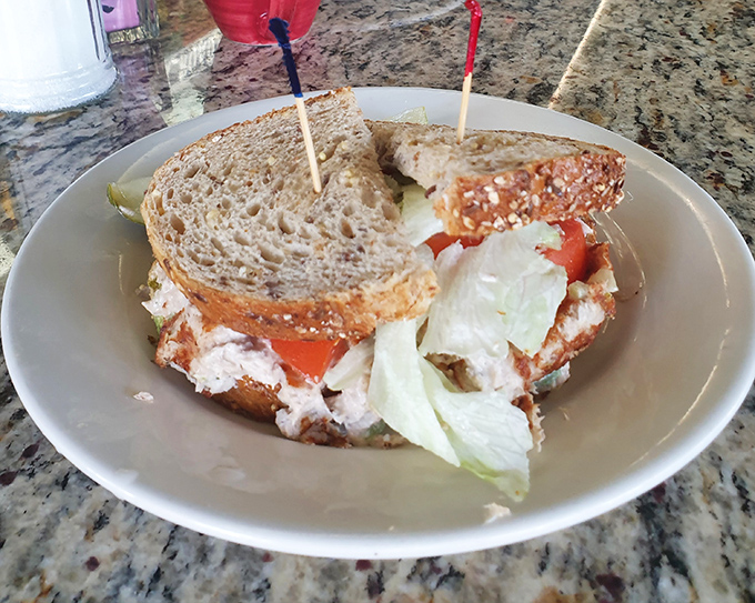 The mark of a great sandwich? It requires strategic planning just to take a bite. This towering creation demands both hands and your full attention.