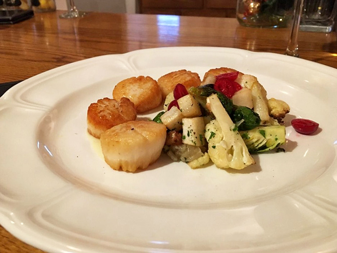 Scallops seared to golden perfection, like little medallions of ocean butter, accompanied by a colorful medley of vegetables that refuse to be upstaged.