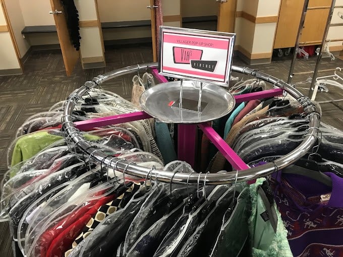 The VIP section—where carefully curated pieces hang in a circular display, like a carousel of fashion possibilities spinning with vintage charm.