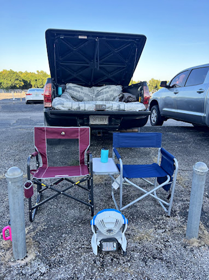 Drive-in veterans know the secret formula: truck bed + comfy chairs + blankets = the VIP section that money can't buy.