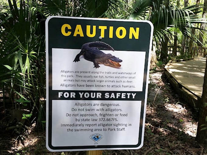 Florida's version of a "beware of dog" sign reminds visitors that these prehistoric residents don't understand the concept of sharing.