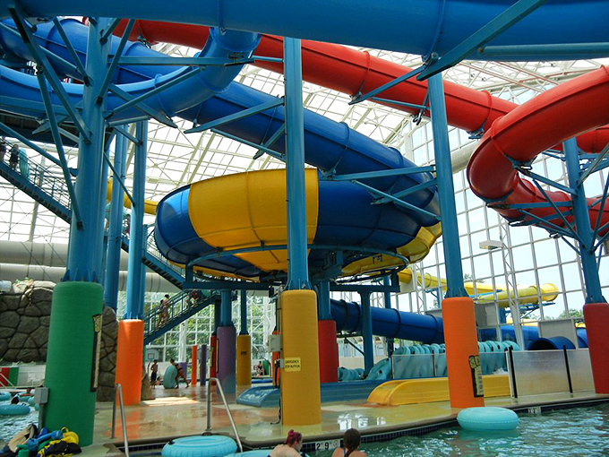 These colorful water slide tubes are basically time machines—you enter as a responsible adult and exit as a giggling 10-year-old. Physics can't explain it.