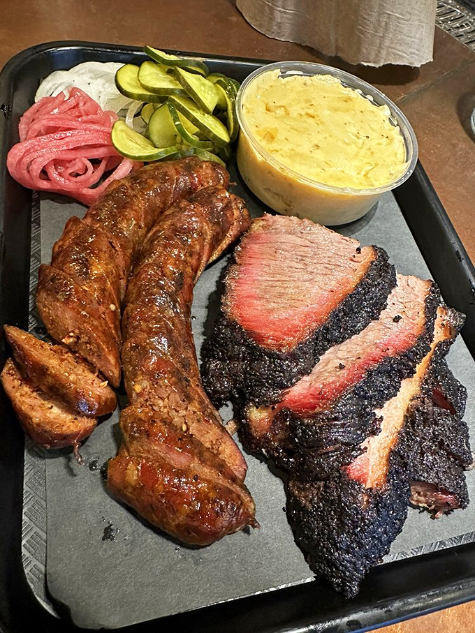 Sausage and brisket share a tray with collards and mac &ndash; a harmony so perfect, orchestras should take notes.