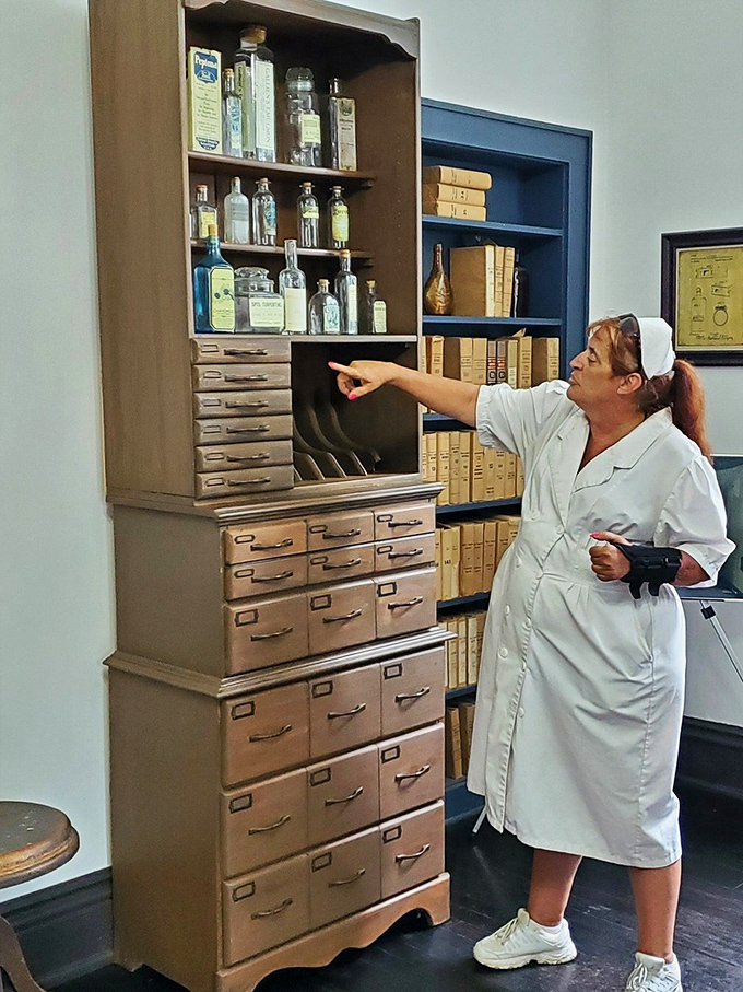 The recreation room's chess set waits for players who will never return. Sunlight streams through barred windows, illuminating a space where patients briefly escaped their reality. 