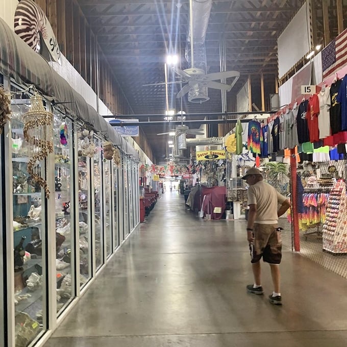 Glass cases glimmer with possibilities as shoppers stroll by&mdash;each booth a miniature retail universe with its own gravitational pull.