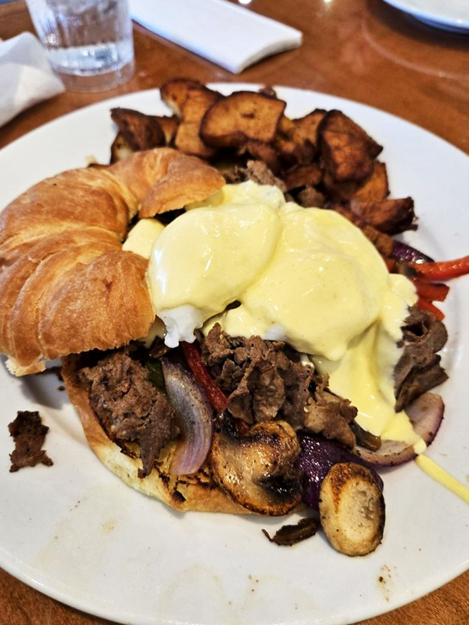 The breakfast sandwich reimagined: tender beef, hollandaise, and home fries that make hitting snooze seem like the worst decision ever.