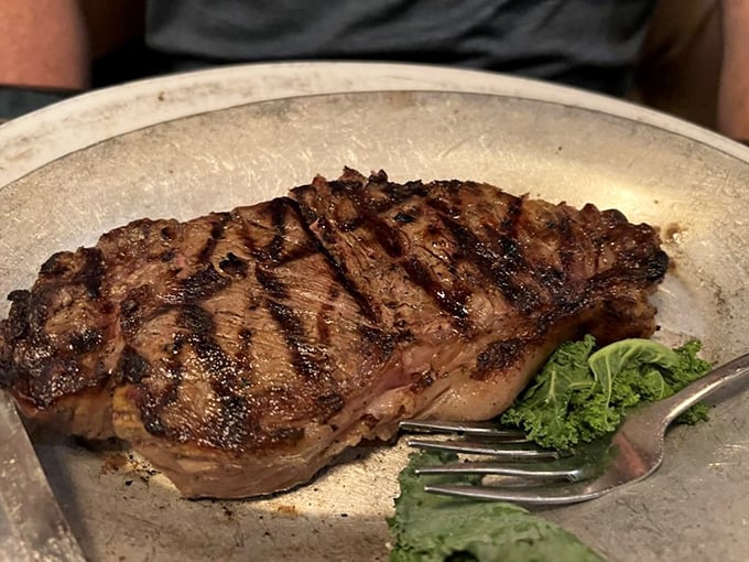 A steak so perfectly cooked, it deserves its own thank-you note. The grill marks are practically autographs from the chef.