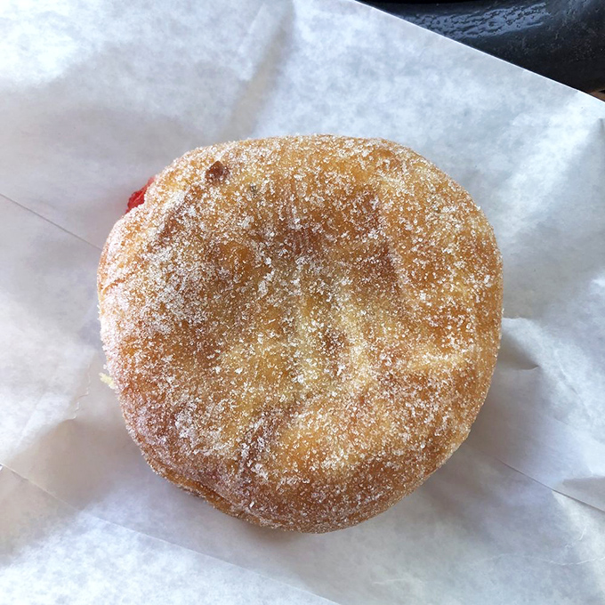 Sugar-dusted and hiding a secret inside—this jelly-filled masterpiece is the donut equivalent of finding an extra $20 in your winter coat.