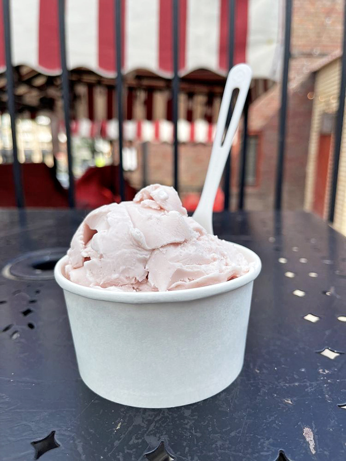 A cup of pink perfection that captures summer in frozen form. This strawberry scoop is what sunshine would taste like if it wore a pink dress.