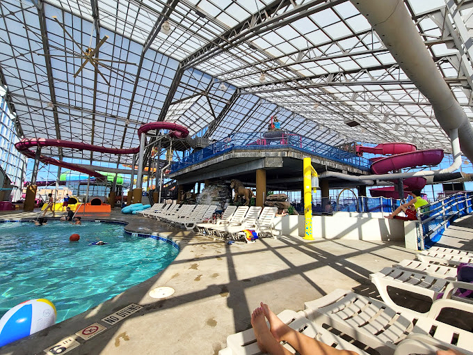 A water wonderland where the ceiling is glass and the possibilities are endless. Those red slides are calling my name like sirens to a sailor.