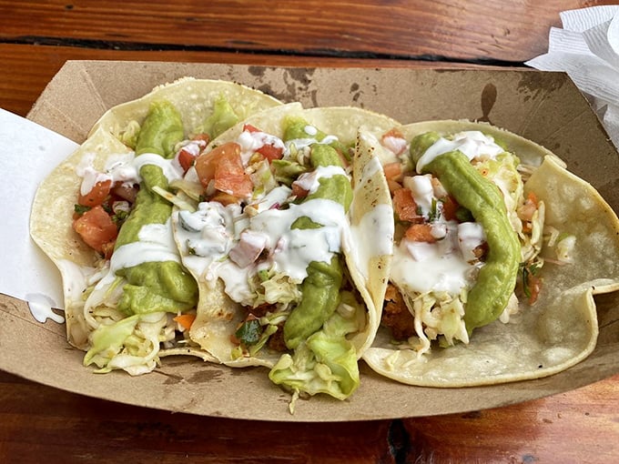 Fish tacos that tell the true California story: fresh, vibrant, and dressed for success with creamy sauce and avocado standing in for Hollywood glamour.