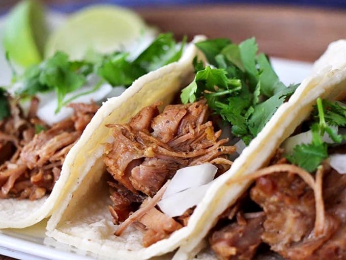 Taco perfection doesn't need to shout. These hand-held treasures let the slow-cooked meat and fresh cilantro do all the talking.