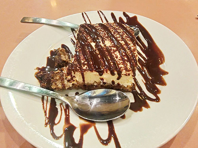 Tiramisu with chocolate drizzle that makes you want to confess your dessert sins. One bite and you'll be speaking in tongues&mdash;Italian ones.