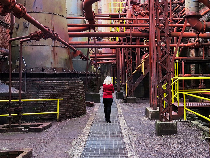 The same interior corridor from image #3, showing the scale of industrial architecture that makes visitors feel like ants in a mechanical colony.