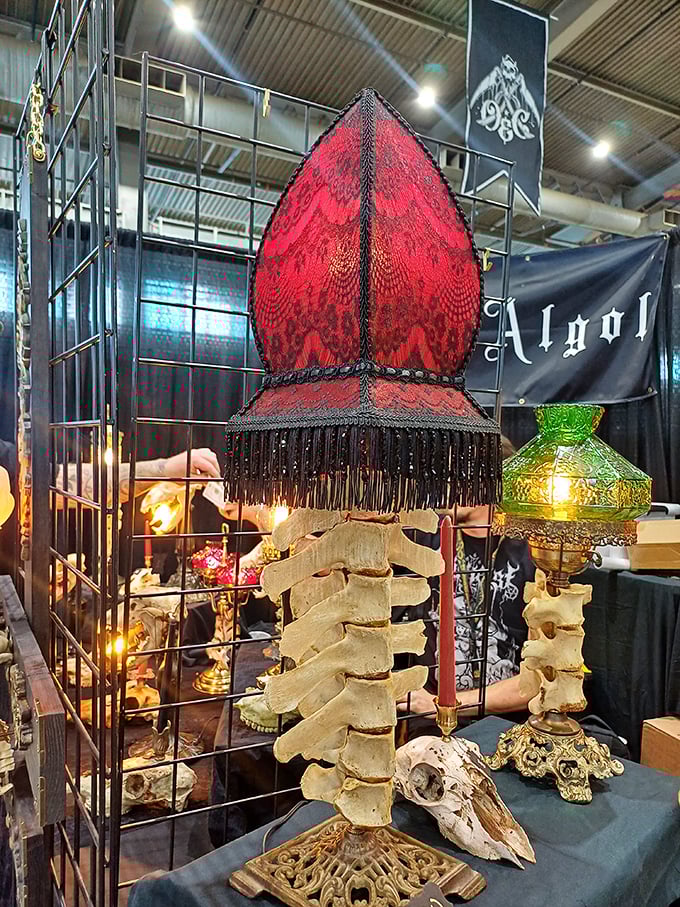 Industrial lighting illuminates a sea of vendor booths. Like a small city of curiosities under one massive roof. 