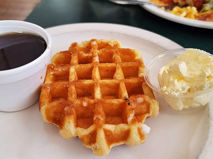 A waffle that stands at attention like a proper station master &ndash; golden, crisp-edged, and ready to be doused in syrup and crowned with butter.