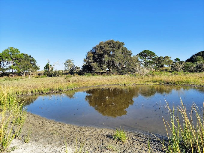 A postcard come to life&mdash;the gentle curve where water meets sand creates the definition of "getting away from it all."