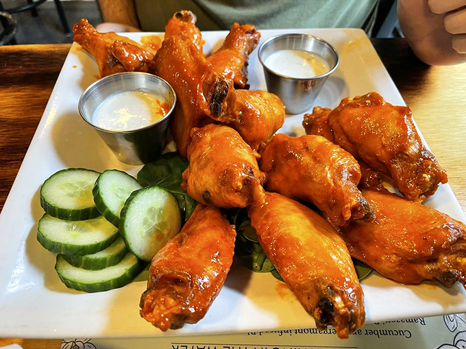 These wings aren't messing around&mdash;gloriously sauced, perfectly crisp, with cooling cucumber slices that won't save you from the heat.