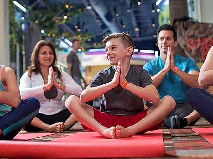 Finding zen amid chaos. Nothing says "balanced family vacation" like a moment of yoga while surrounded by the distant echoes of splashing and sugar-fueled excitement.