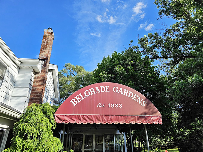 Belgrade Gardens' charming entrance and classic red awning welcome you to a fried chicken tradition dating back to 1933.