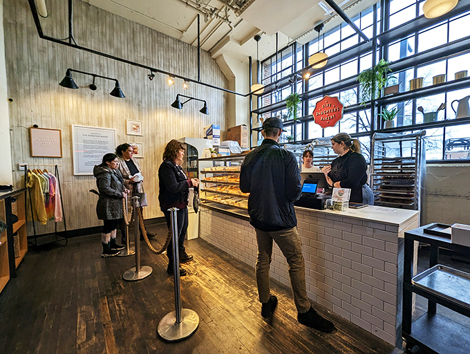 Five Daughters' industrial-chic interior with wooden floors and vintage lighting sets the perfect stage for donut drama.