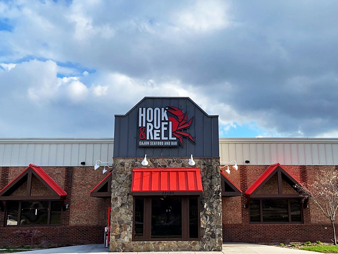 Hook & Reel's stone-and-brick entrance says "casual," but that red door whispers "the seafood boil of your dreams."