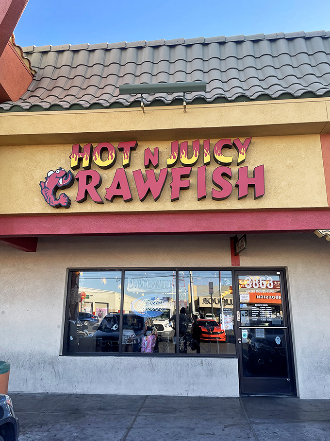Hot N Juicy's vibrant sign promises exactly what it delivers &ndash; crawfish that'll have you reconsidering your shirt choice.