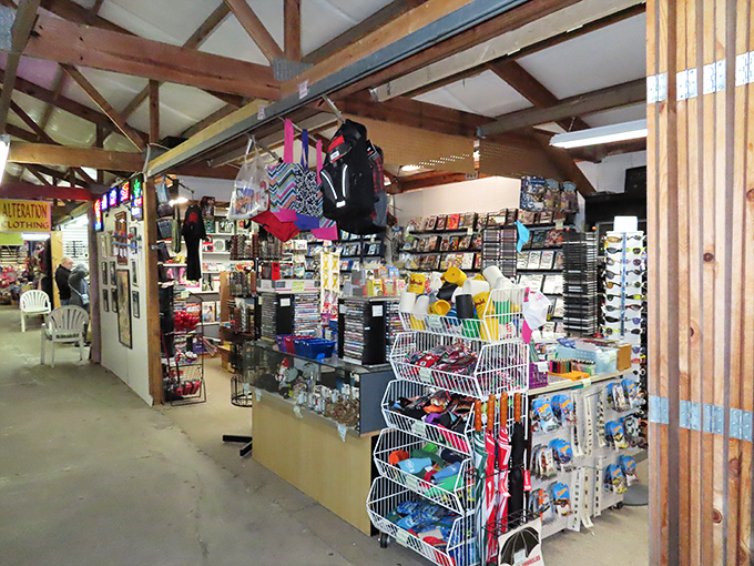 Hudson's Surfside Flea Market's wooden rafters shelter a rainbow explosion of merchandise, where beach culture meets bargain hunting in perfect retail harmony.