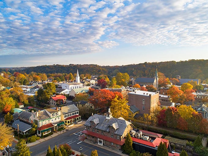 Lambertville's fall foliage frames a downtown where church steeples still dominate the skyline instead of office towers.