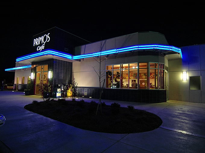 Primos Cafe glows with blue neon promise in the evening hours, like a time machine ready to transport you to breakfast bliss.