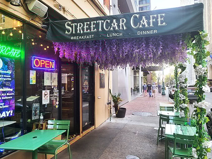 Purple wisteria cascading over Streetcar Café's entrance—Mother Nature's way of dressing up for breakfast.