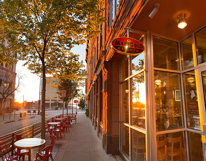 The Marigold Kitchen's inviting storefront promises morning magic with its coffee, bakery, and breakfast trifecta of perfection. 