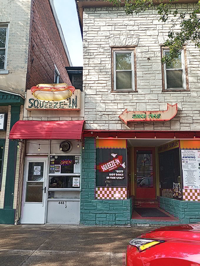 The Squeeze-In lives up to its name with this narrow storefront. That vintage neon sign has been guiding hungry folks since 1945! 