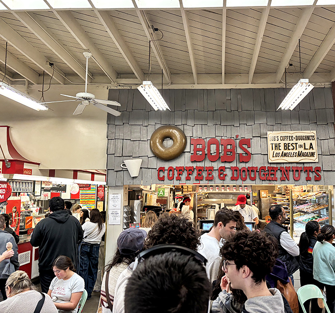 That golden donut sign hanging above the counter isn't just decoration—it's a beacon guiding hungry Angelenos to fried dough nirvana.