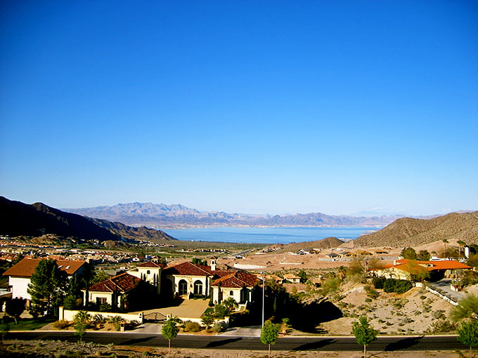 Lake Mead shimmers beyond Boulder City's hillside homes – waterfront proximity without the waterfront property tax bill.