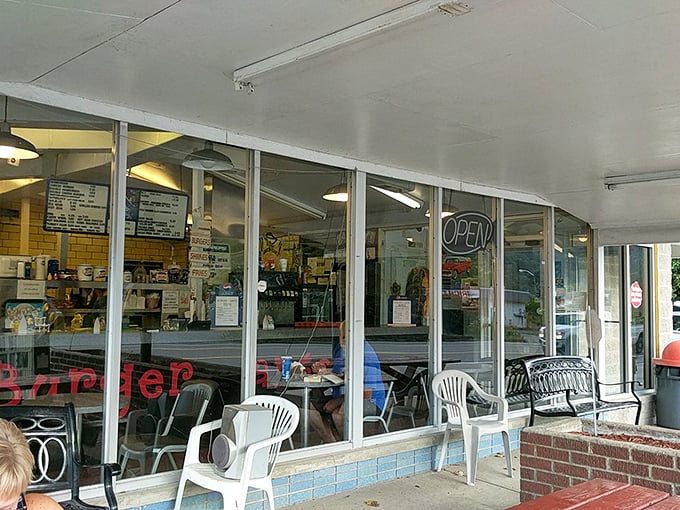 Behind these windows lies the secret to happiness: perfectly grilled burgers and ice cream cones taller than your childhood dreams.