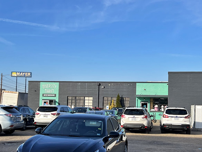 The green entrance pops against the gray building like an invitation to a secret club. The password? "I love bargains!"