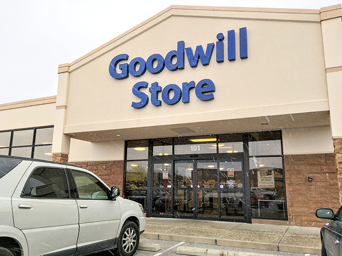 The unassuming entrance to a world of possibilities. Goodwill's storefront promises treasures waiting just beyond those doors!