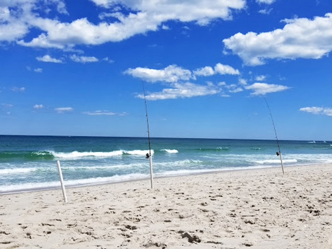 Beach therapy in session! Two fishing poles stand at attention, waiting for striped bass and patient anglers at Island Beach State Park.