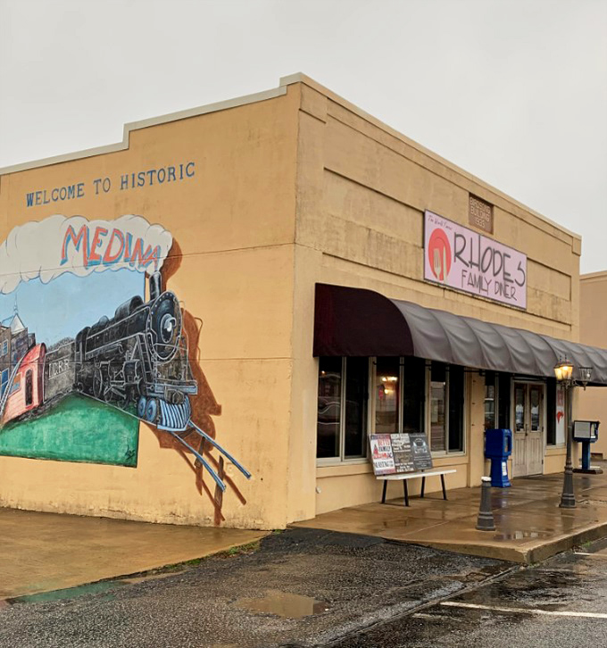 Rain-slicked sidewalks lead to this beige beacon of breakfast hope, where biscuits achieve their highest purpose in life.